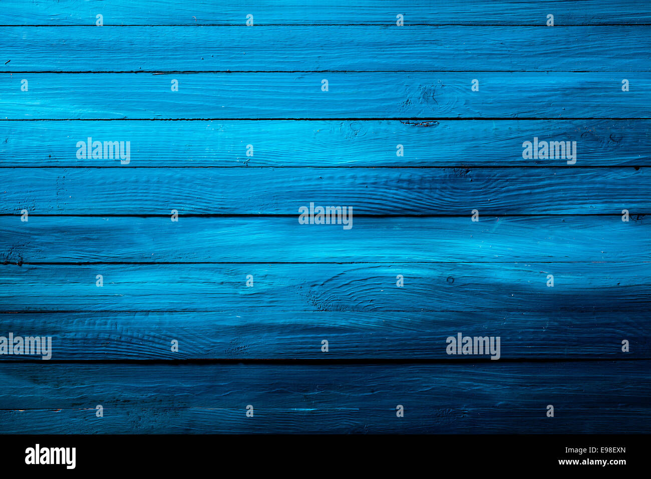 Colorful rich blue wooden background texture with a graduuated colour ...