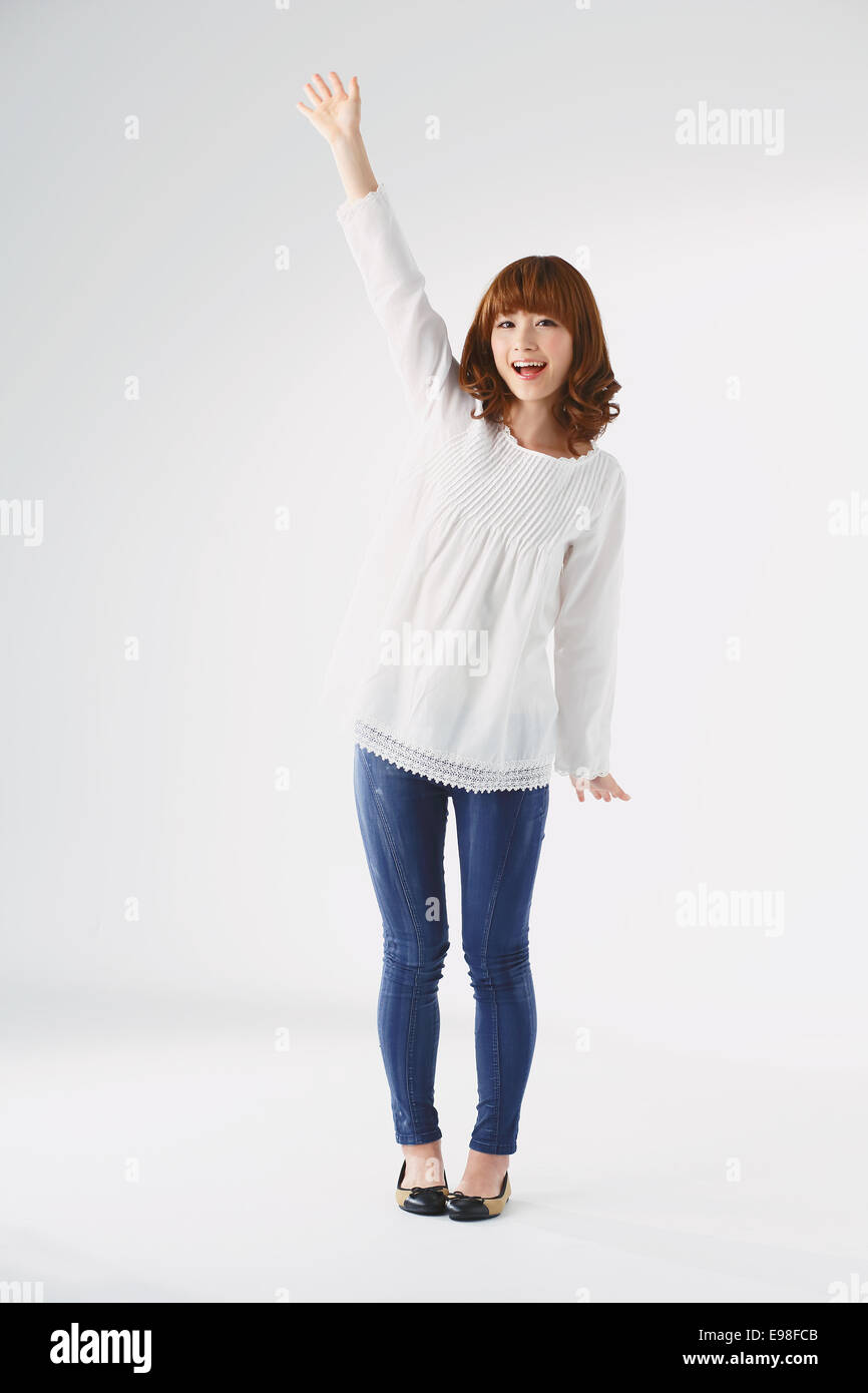 Beautiful woman waving arms pose hi-res stock photography and images ...