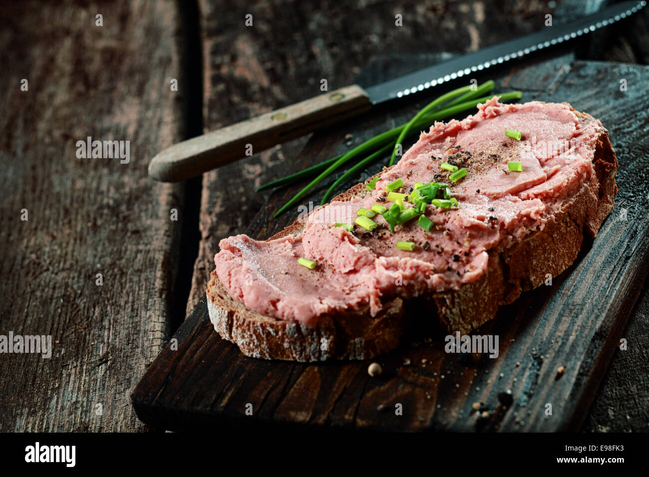 Savory smoked German teewurst on a slice of rye bread topped with ...