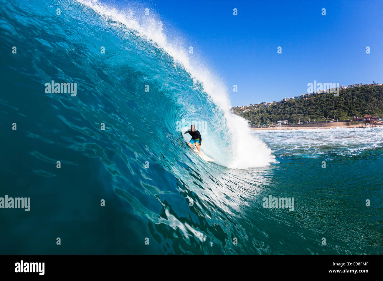 Surfer surfing rides ocean wave close photo action Stock Photo - Alamy