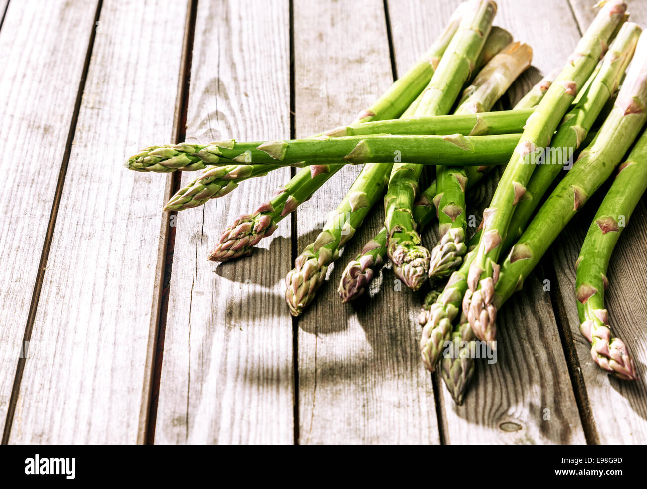 Bundle of fresh green asparagus shoots, tips or spears on display at ...
