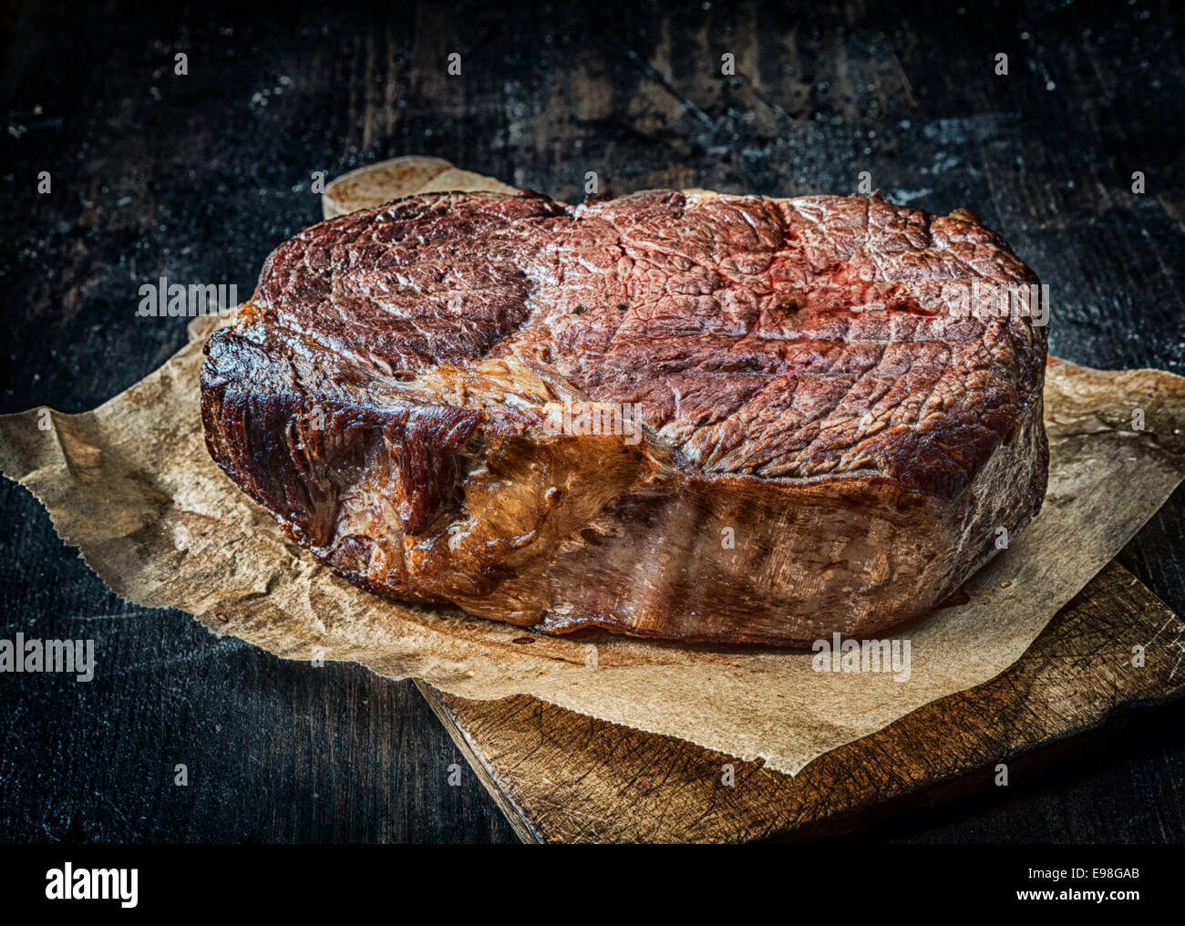 Portion of succulent tasty grilled lean beef steak served on brown ...