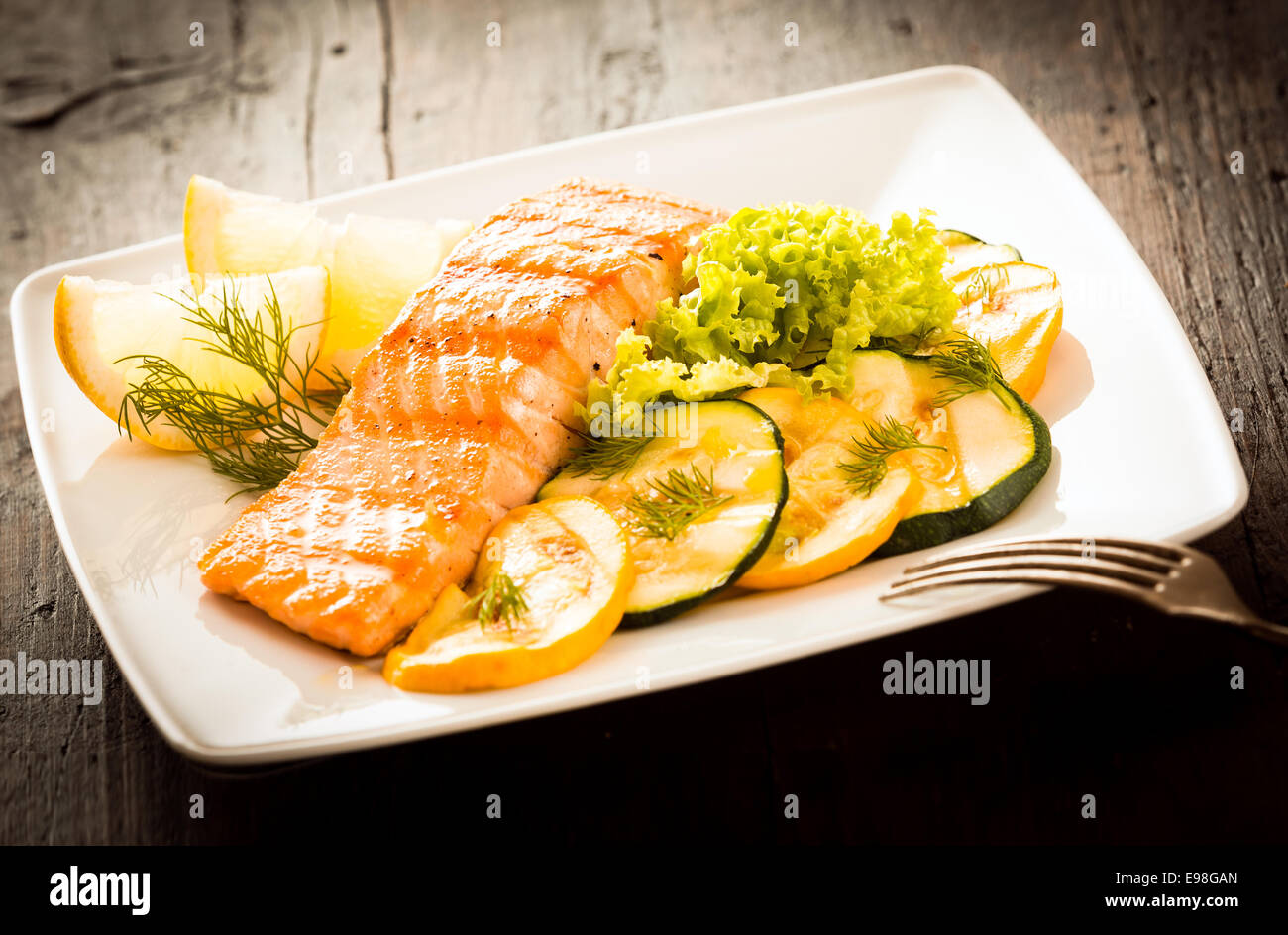 Gourmet portion of grilled fresh pink salmon served with roast ...