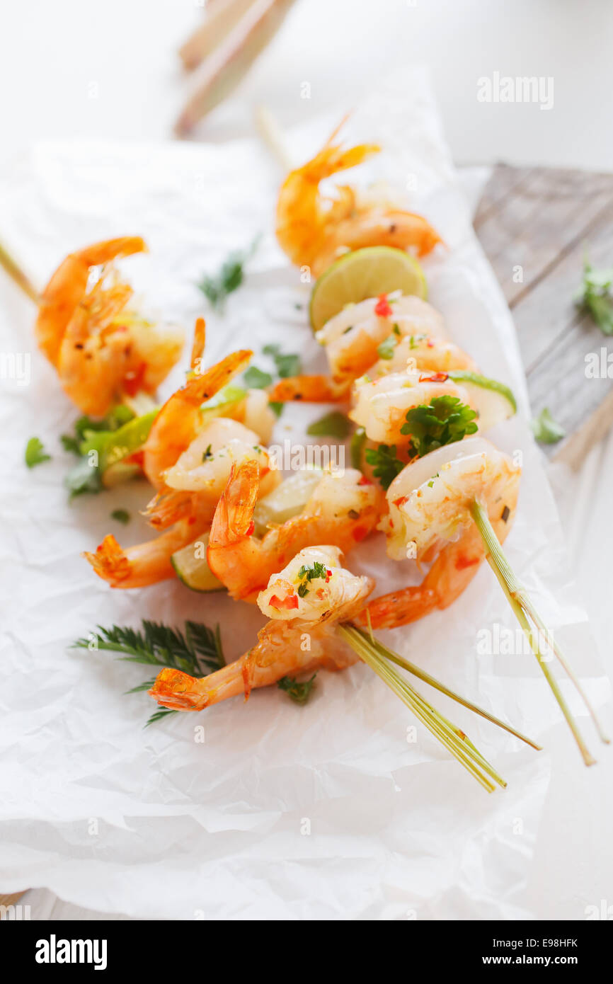 Prawn or shrimp kebab appetizer with grilled pink prawn on skewers with ...