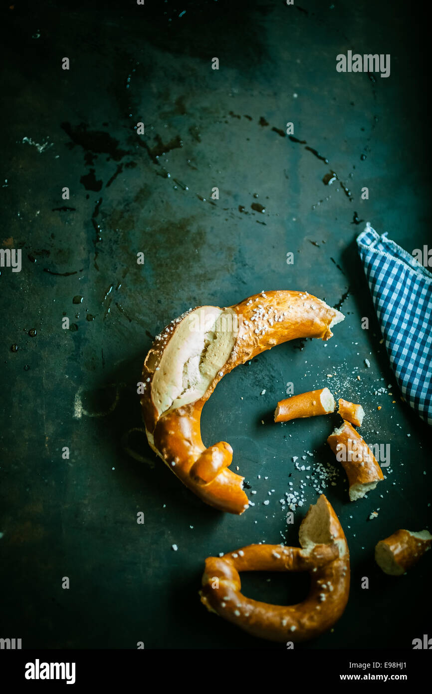 Broken tasty salted pretzel biscuit, a hard crisp savory bread in the ...