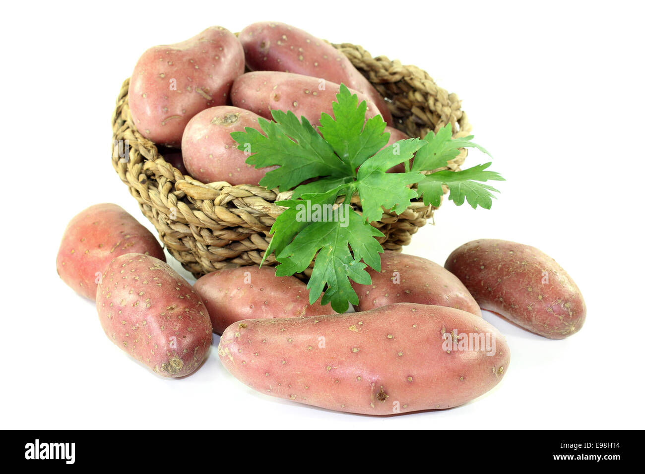 raw, red potatoes on a white background Stock Photo - Alamy
