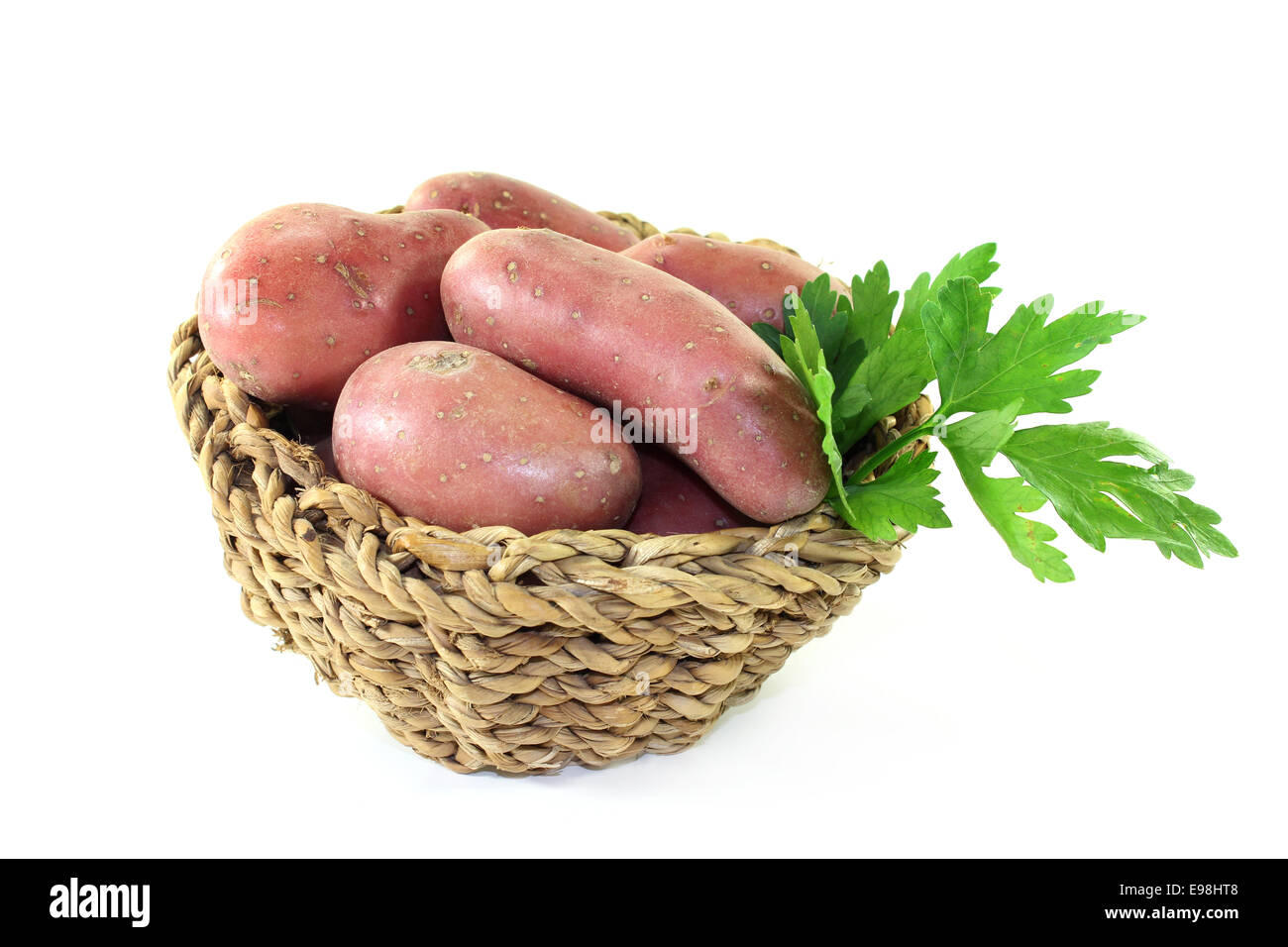 raw, red potatoes on a white background Stock Photo - Alamy