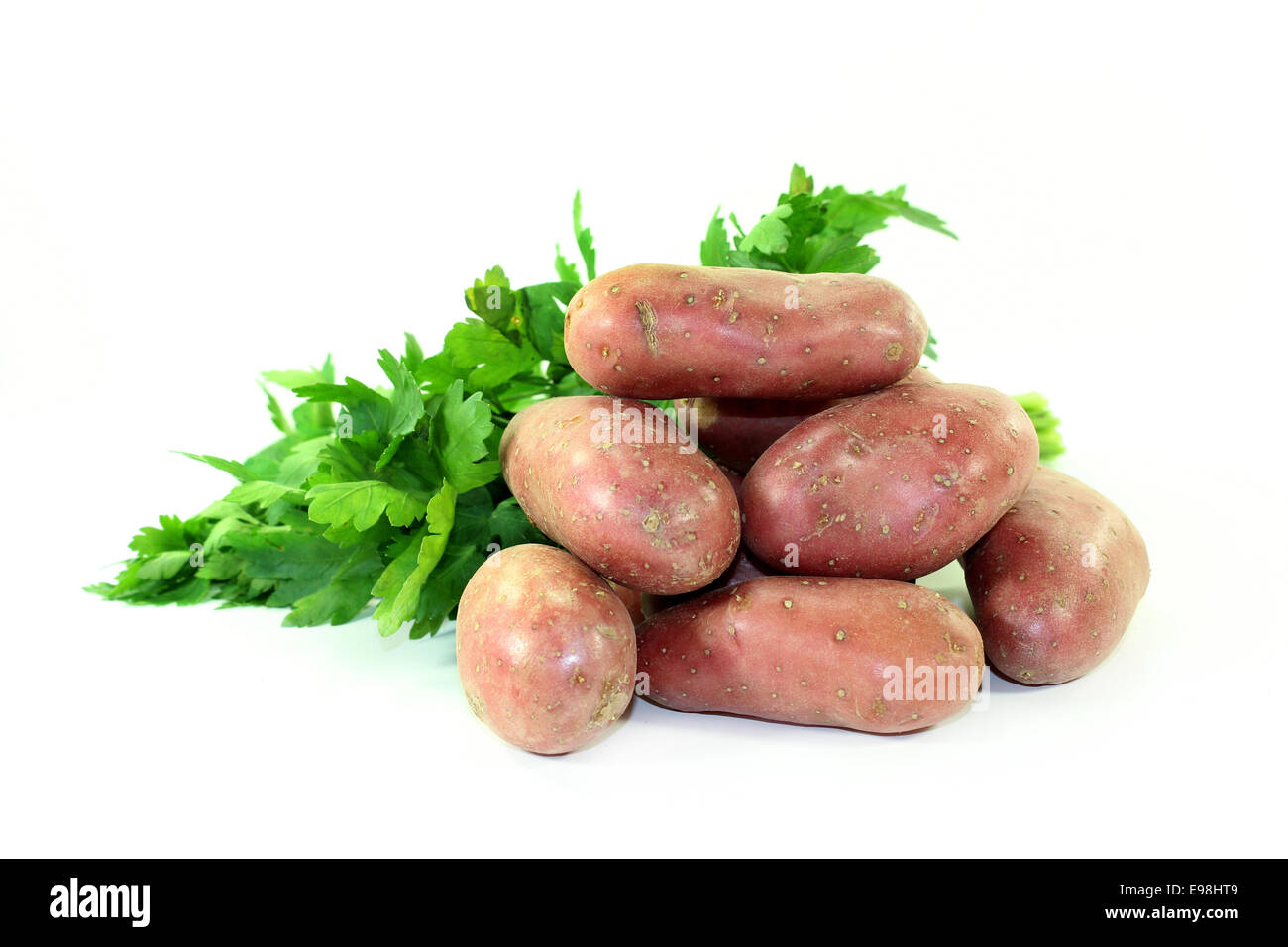 raw, red potatoes on a white background Stock Photo - Alamy