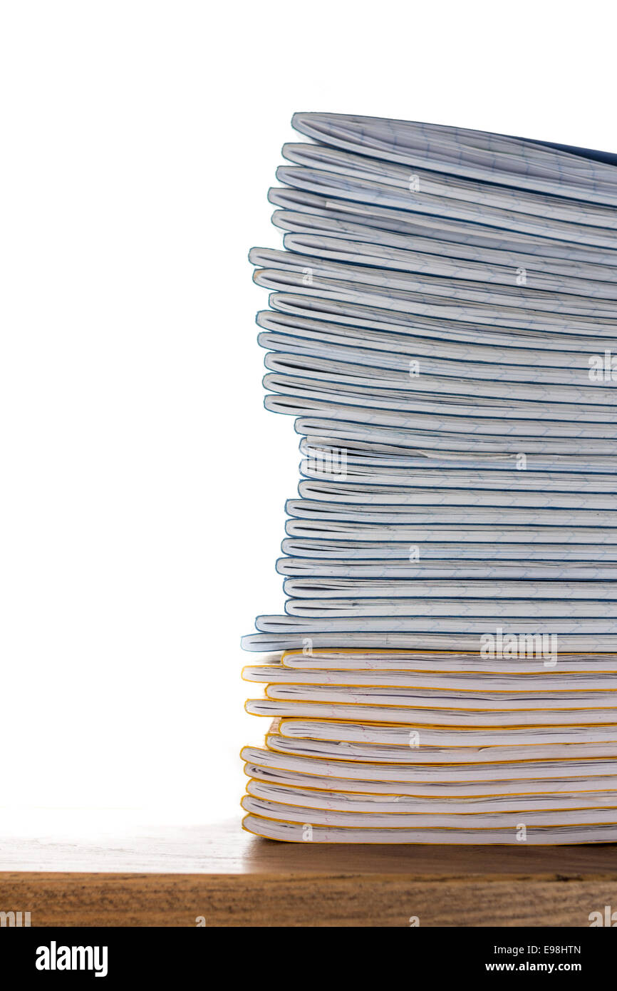 Primary school books waiting to be marked Stock Photo - Alamy