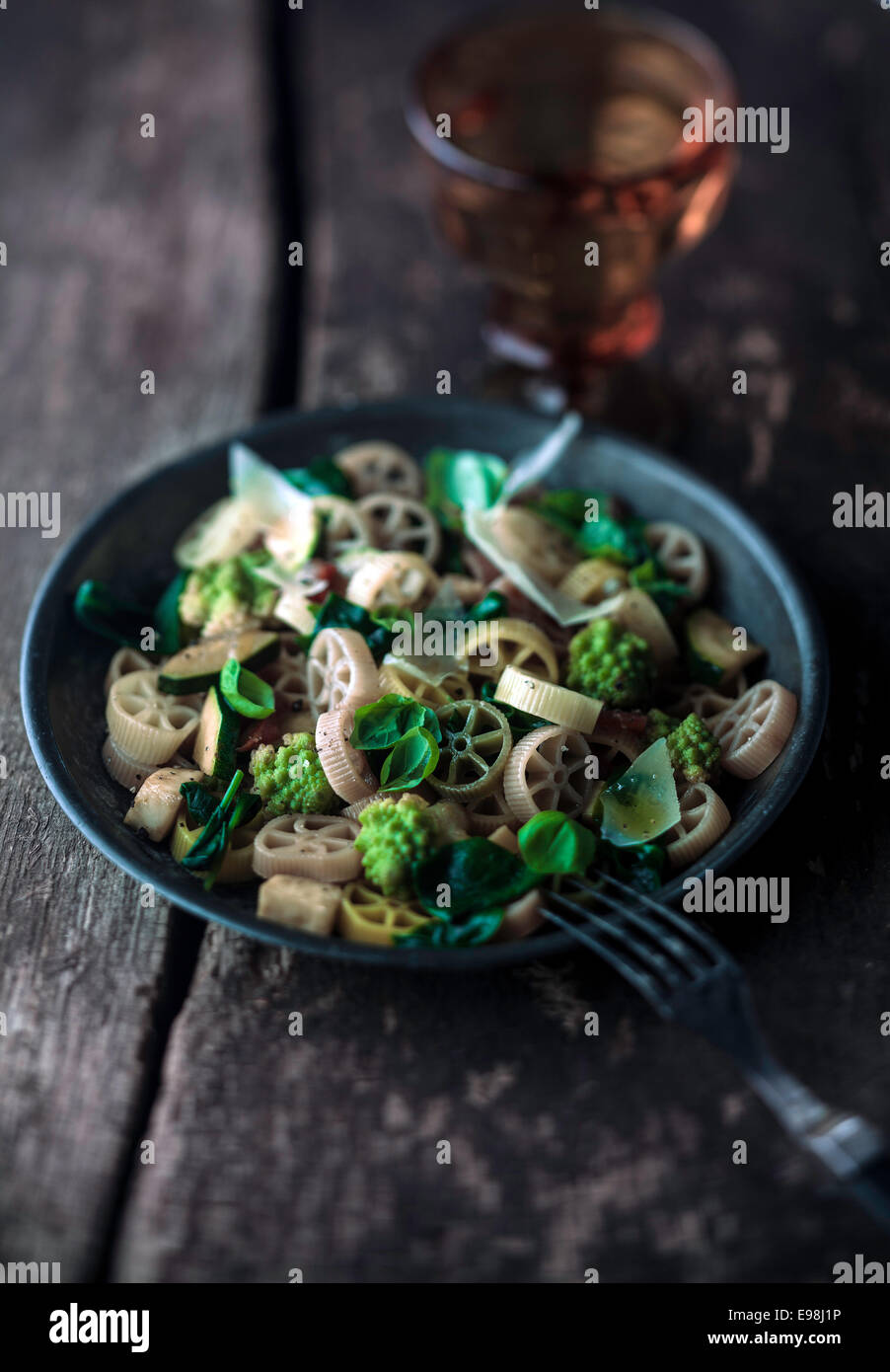Tasty Pasta Rotelle Wheels in Plate on Vintage Background Stock Photo ...