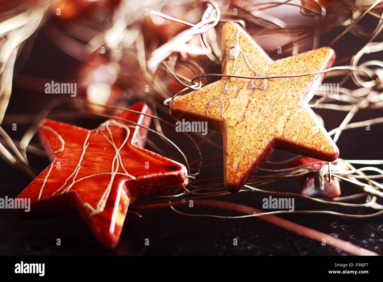 Decorating for Christmas festivities with a jumbled background of two ...