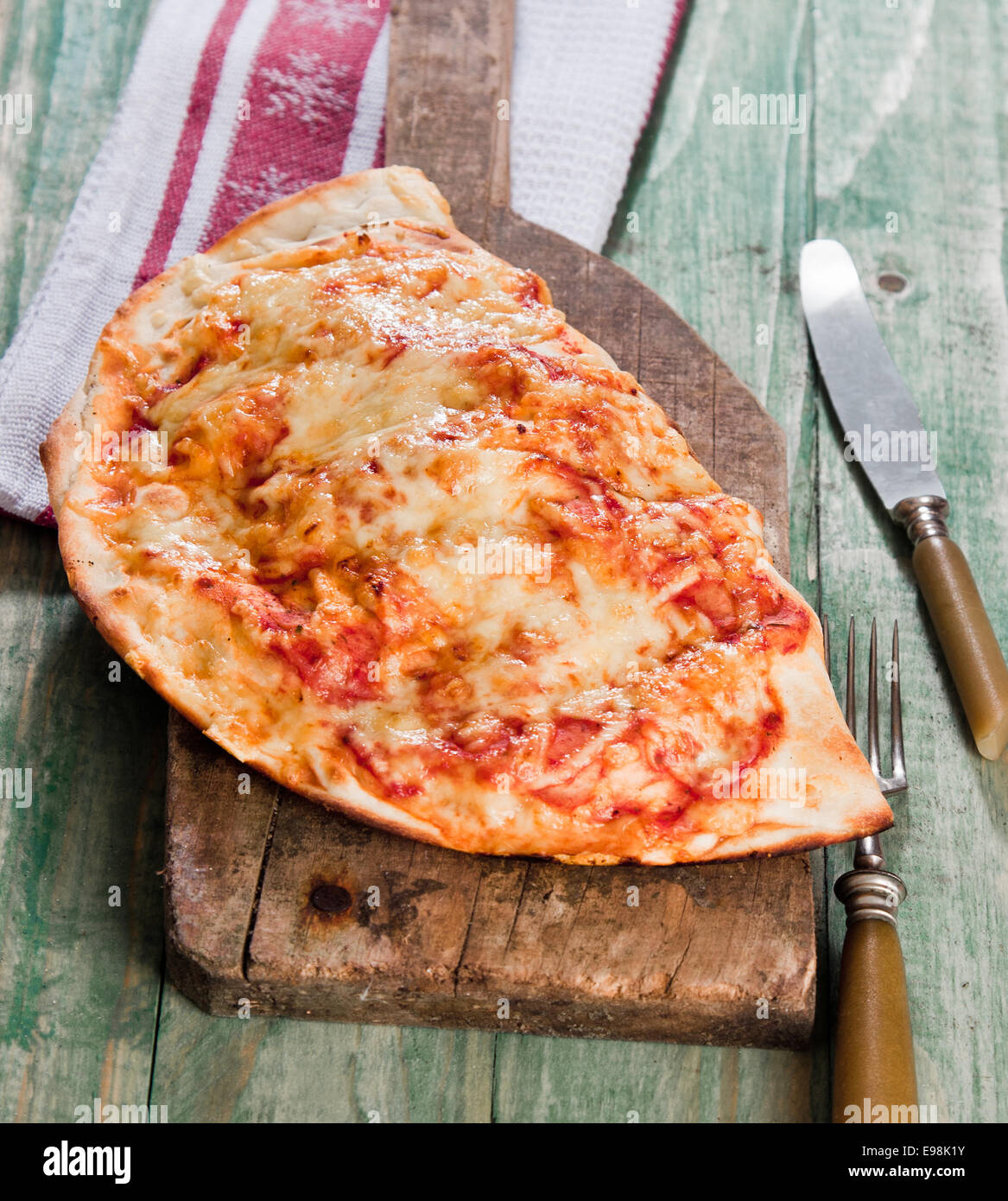 calzone pizza on a wooden background, especially for restaurants Stock ...