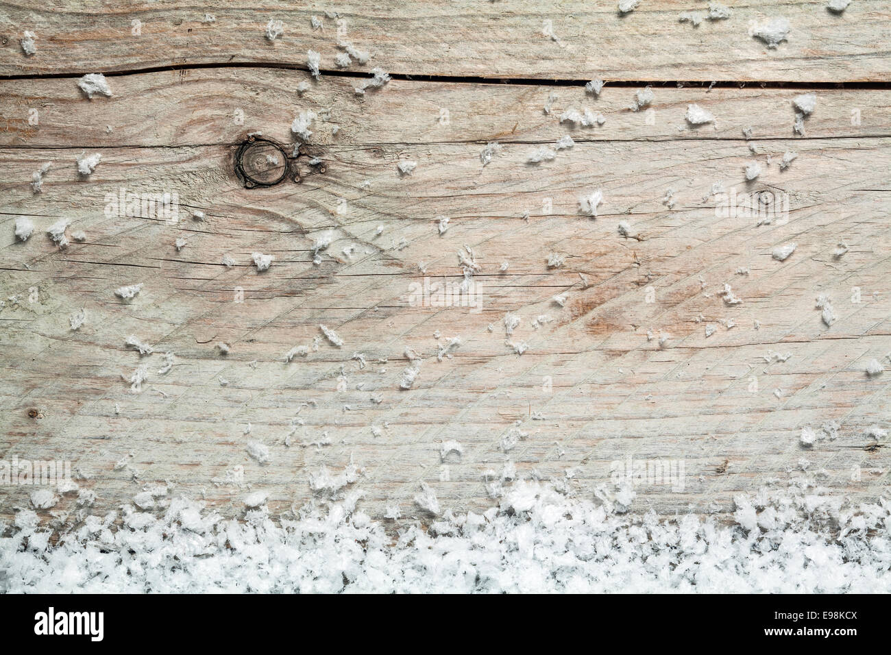 Rustic wooden background with winter snow on the bottom border and ...