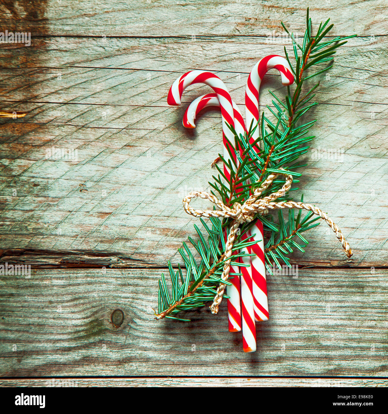 Colorful striped red and white Christmas candy canes tied in a bundle ...