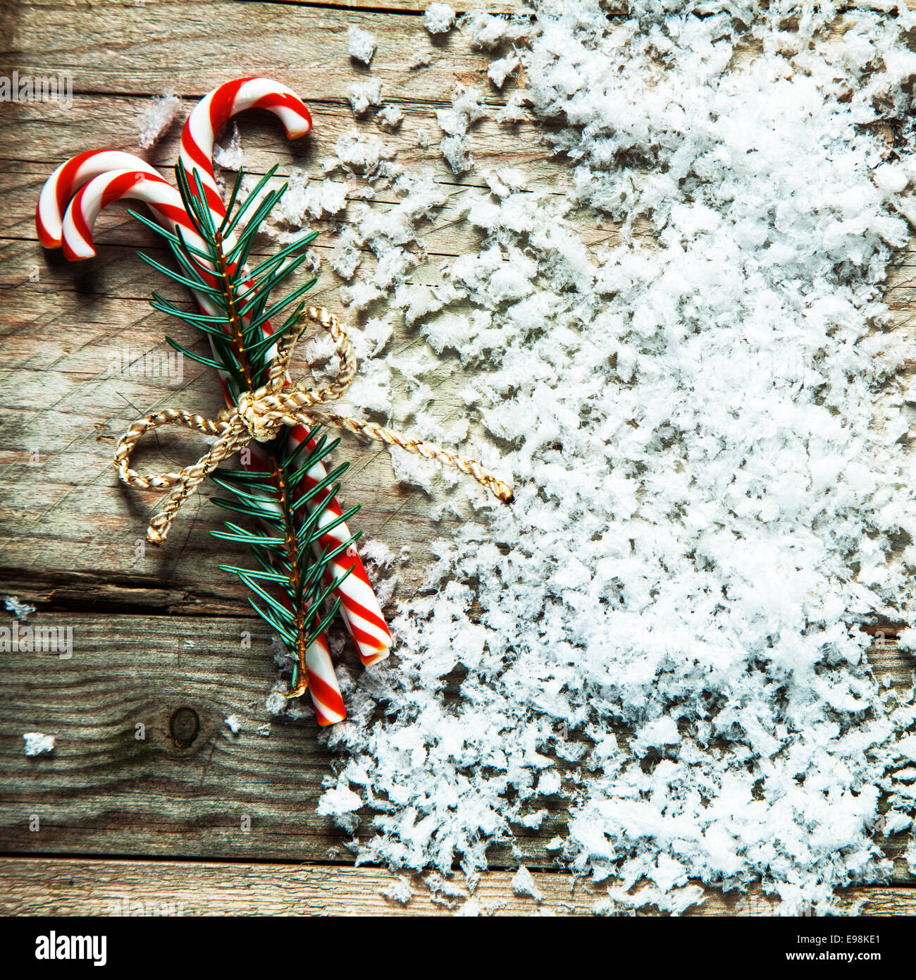 Bundle of striped red and white Christmas candy canes tied with string ...