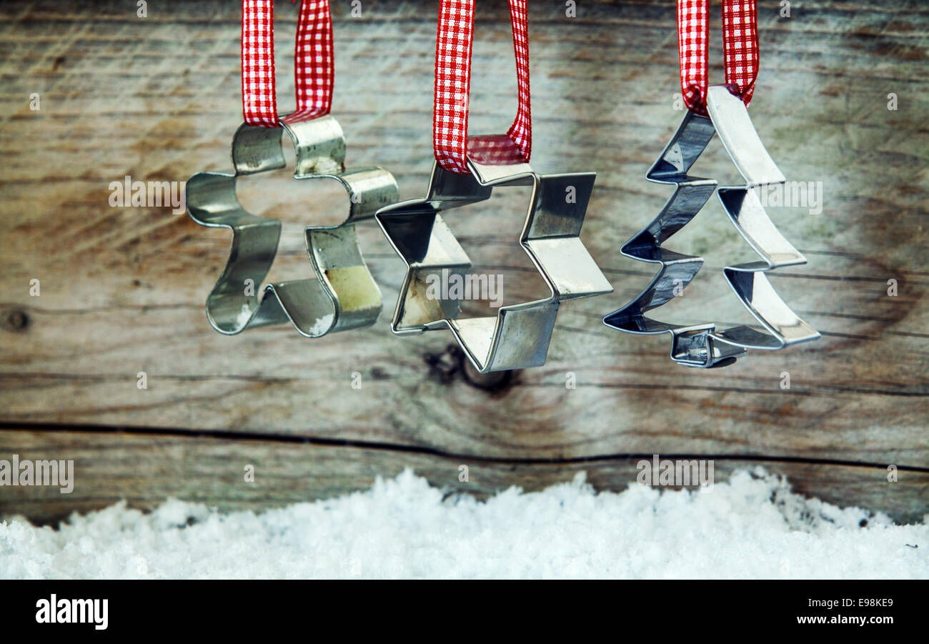 Christmas cookie cutter background with metal cutters shaped as a ...