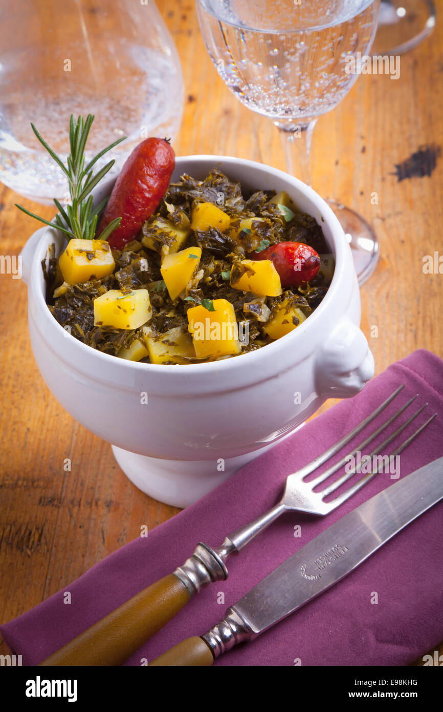 Ethnic place setting of a delicious looking dish with borecole and ...
