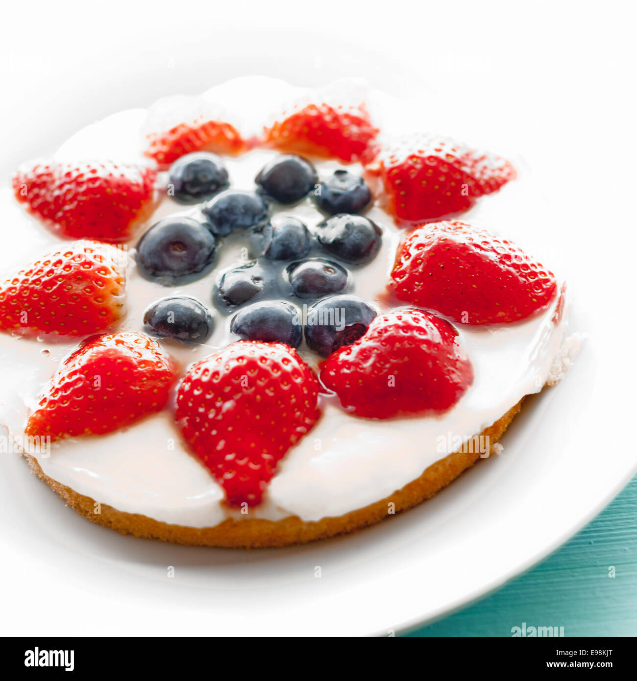 Rich Gourmet strawberry tarte of a striped cake base topped with ...