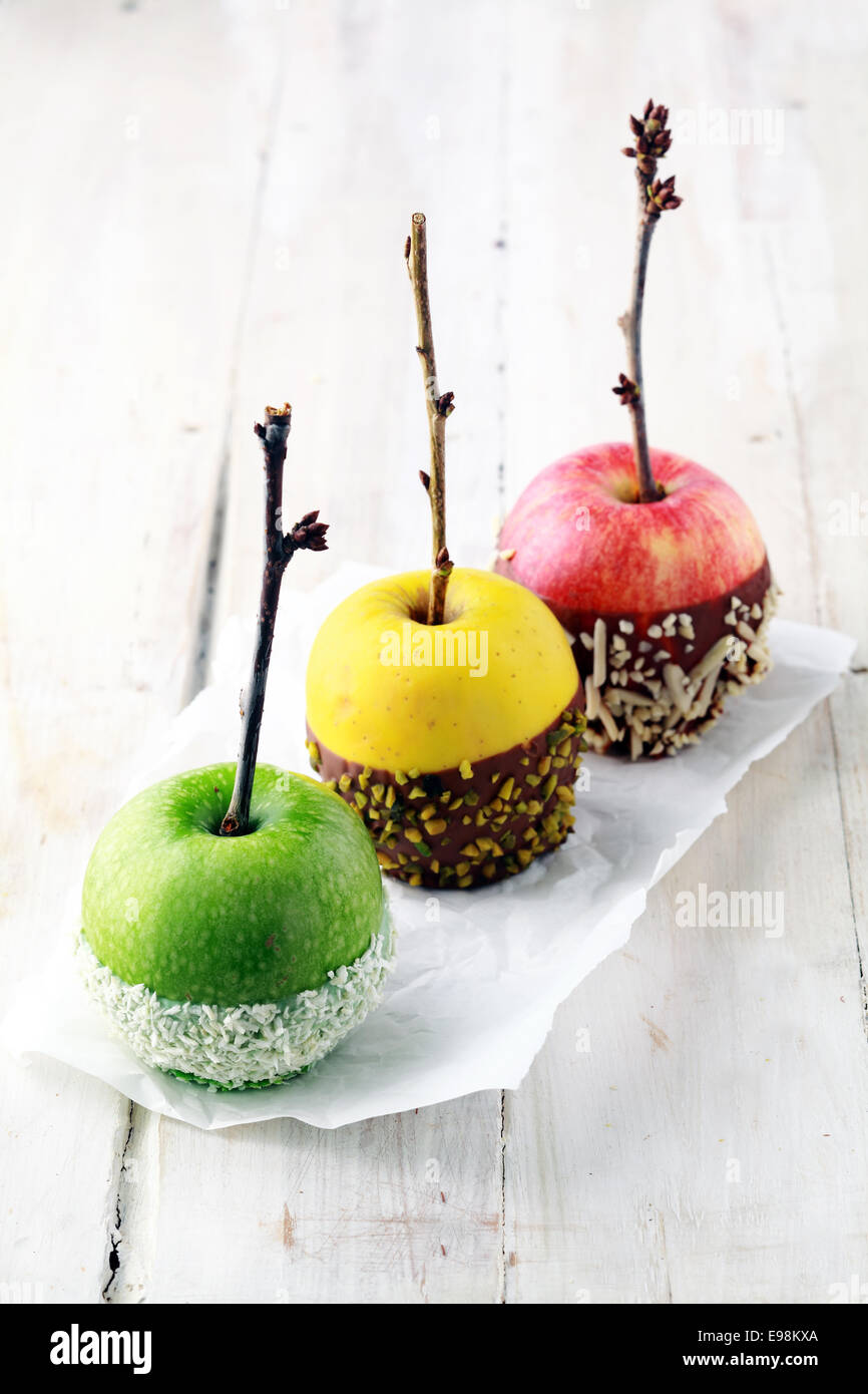 Colorful trio of candied apples for Halloween with a red, green and ...