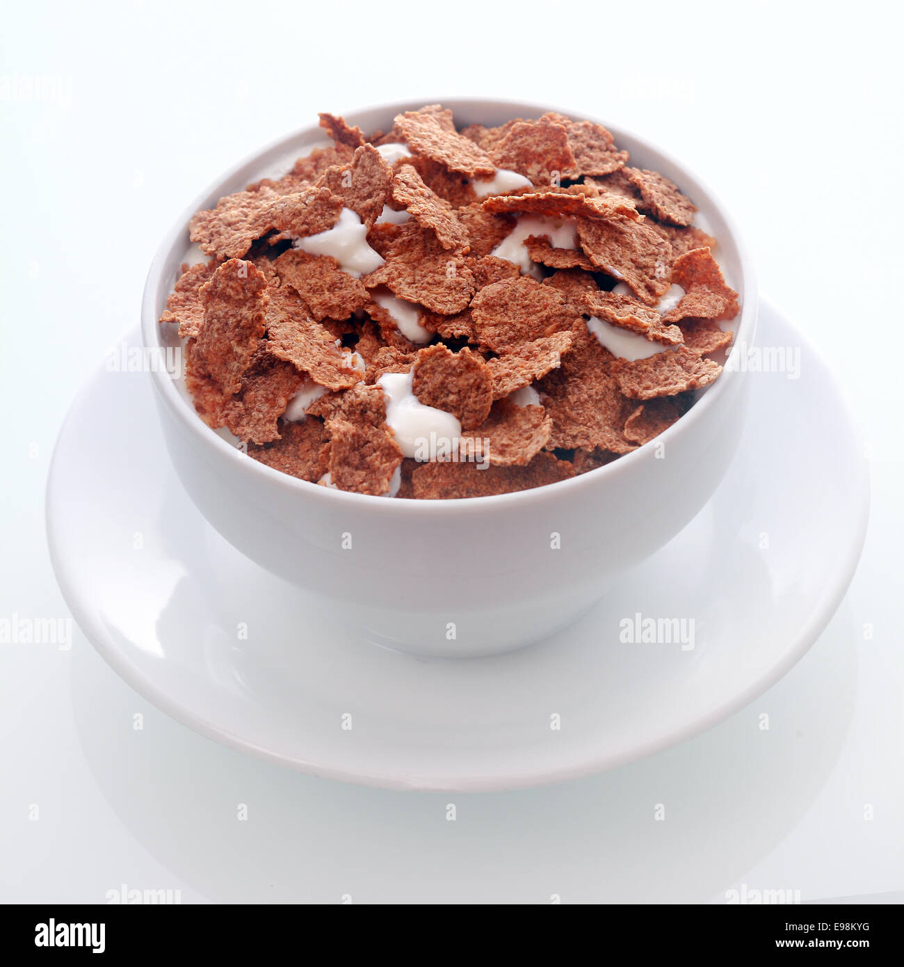 Bowl of crispy flakes of chocolate flavored breakfast cereal in milk ...