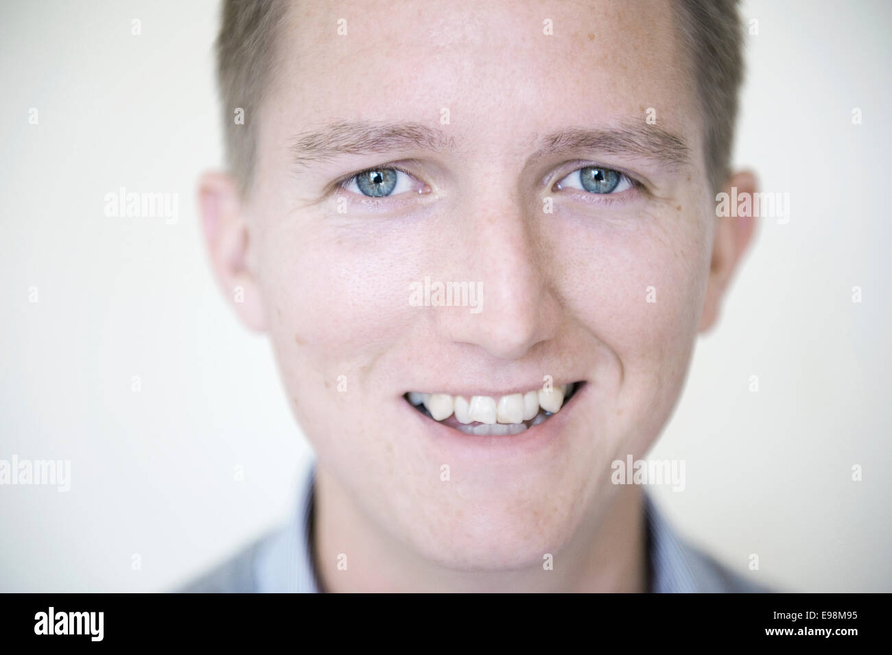 close up of an average mans calm, smiling face taken for a profile shot ...