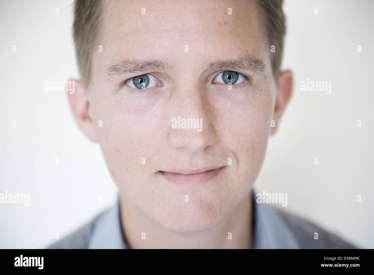 close up of an average mans calm, smiling face taken for a profile shot ...