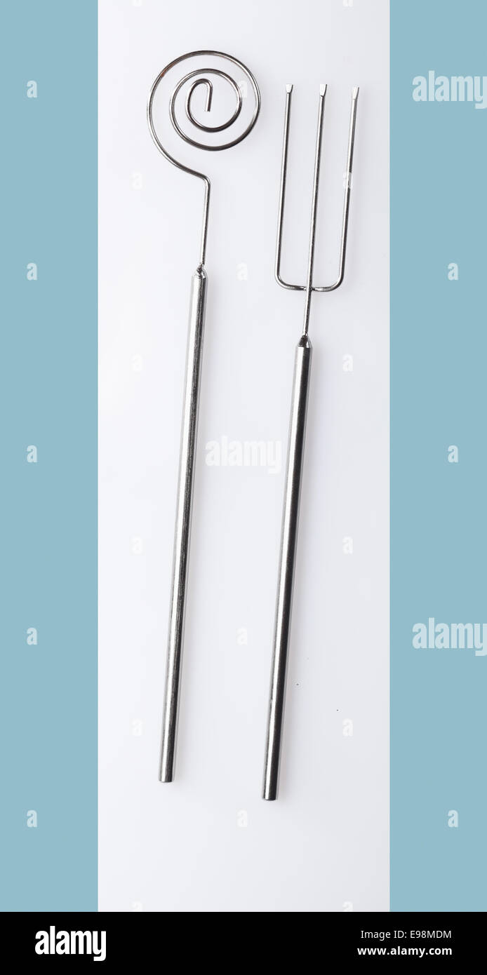 Delicate metal serving utensils of stainless steel with a coiled loop ...