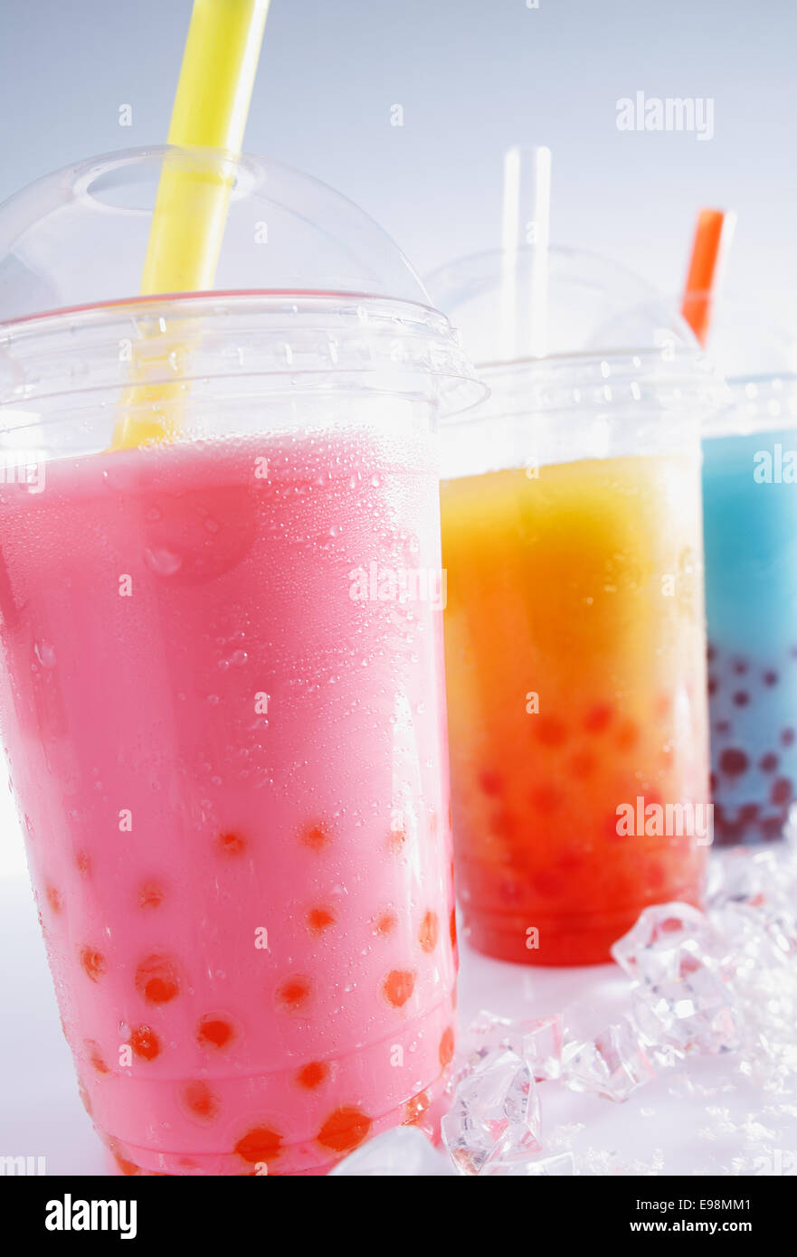 Assorted Bubble Tea Drinks on crushed ice with fruit pearls Stock Photo ...