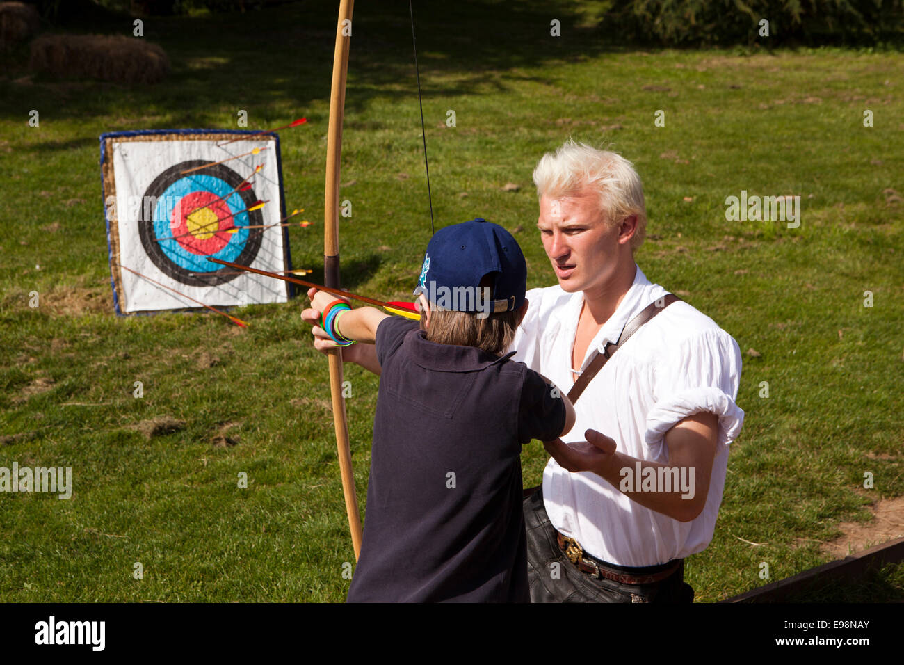 UK, England, Warwickshire, Warwick Castle, young boy having archery ...