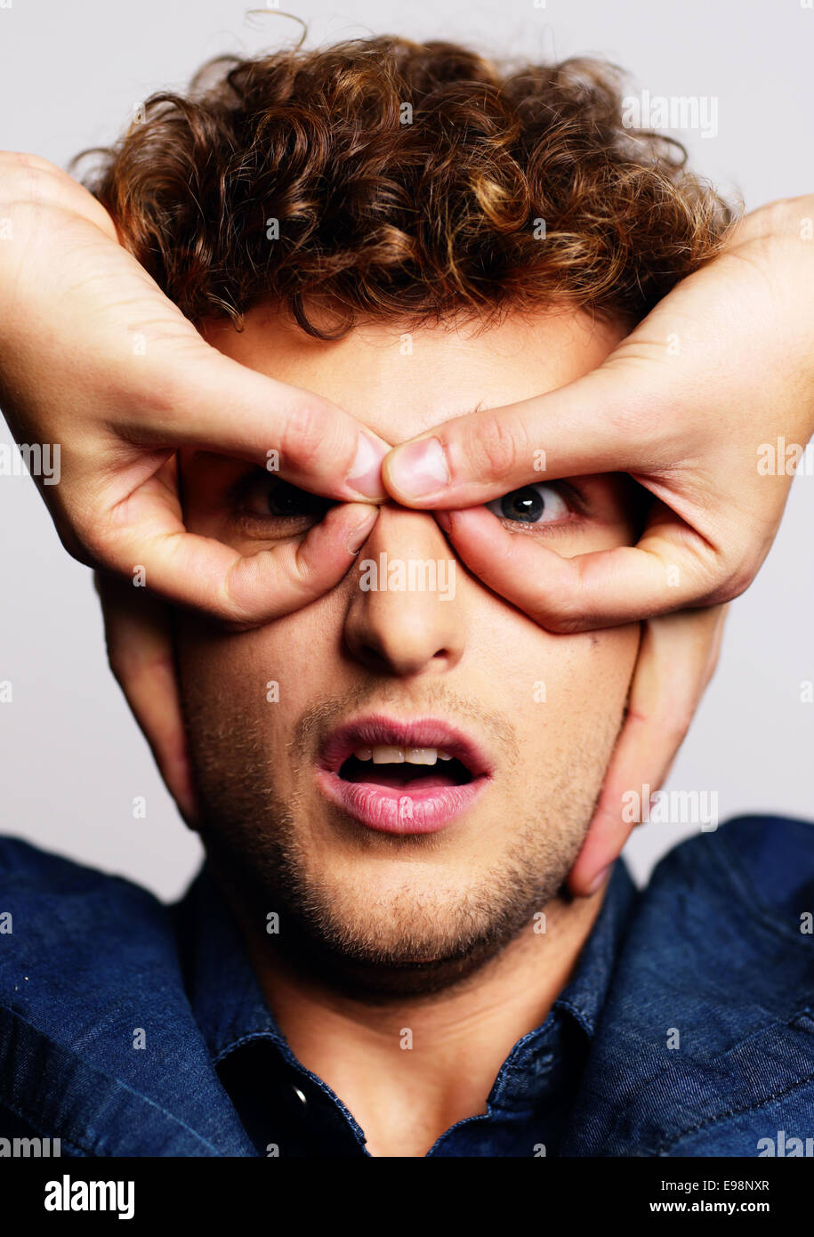 Funny man binoculars hi-res stock photography and images - Alamy