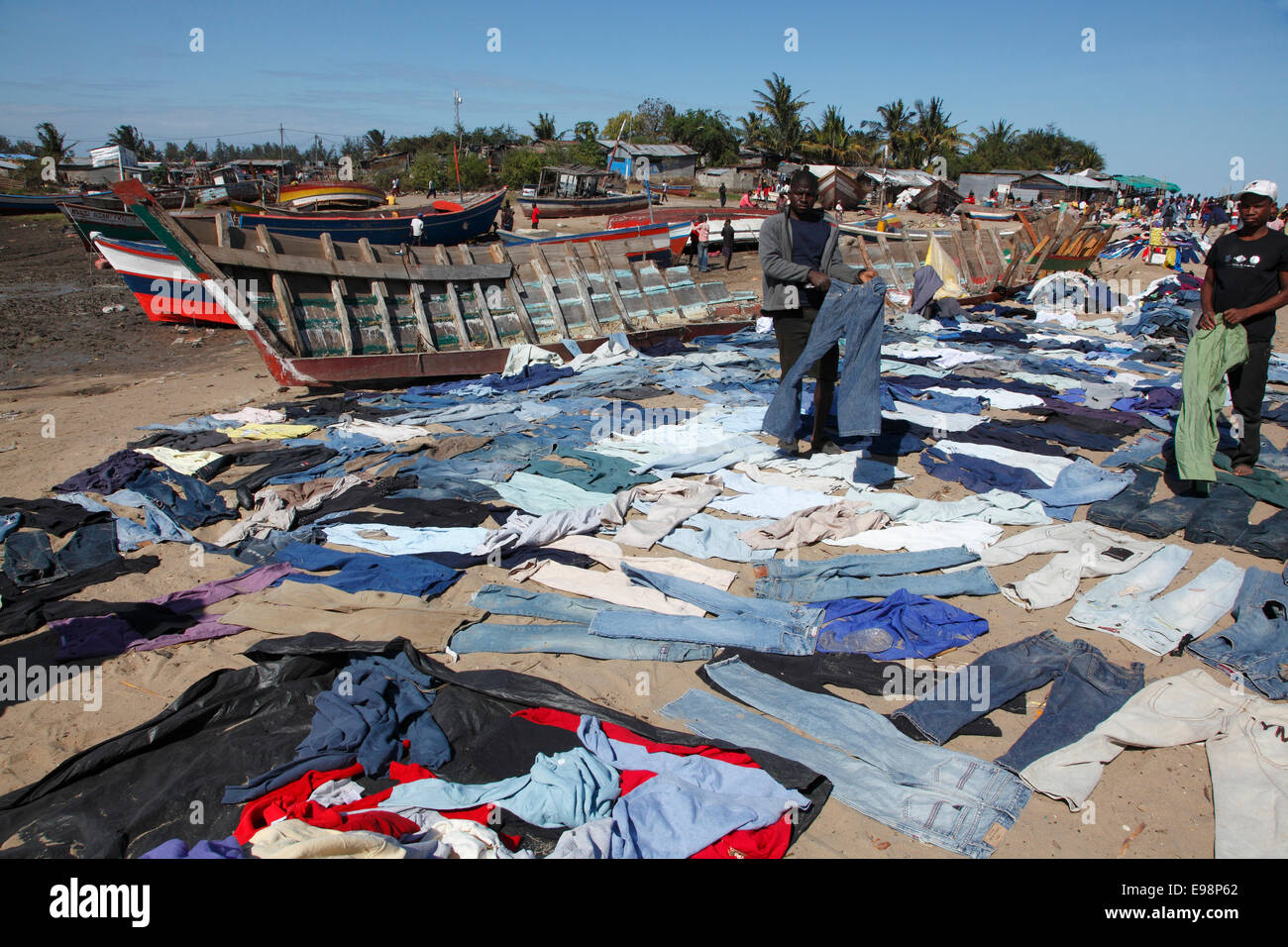 Second hand jeans for sale at the market on the city beach. Beira ...
