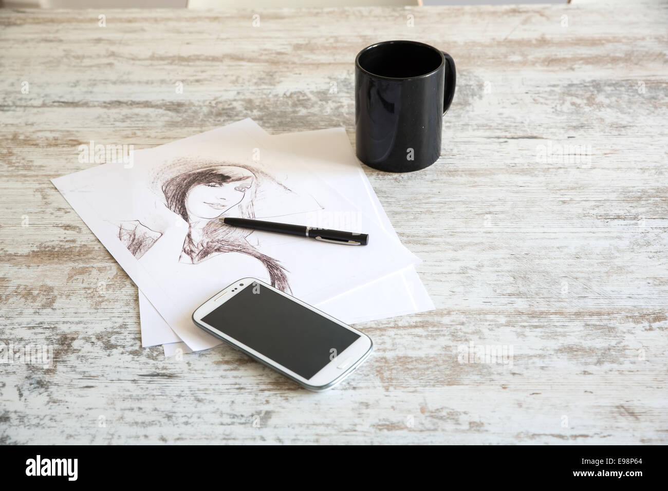 Drawing a sketch on the Table Stock Photo - Alamy