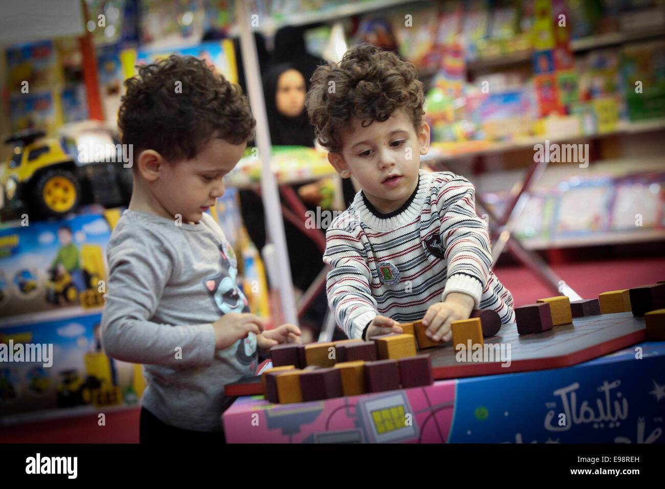 Tehran, Iran. 21st Oct, 2014. Iranian children play toys during a toy ...