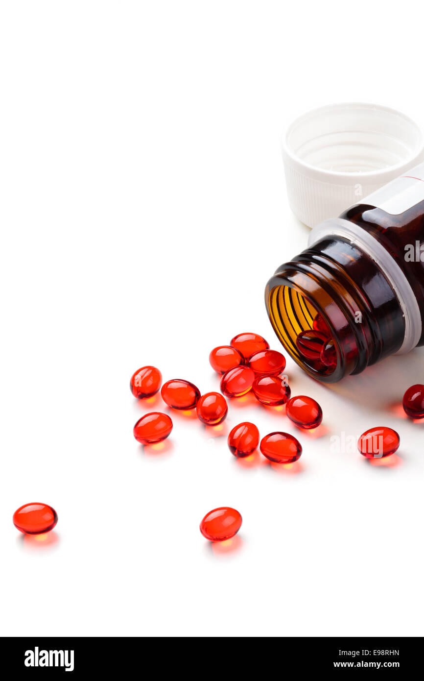 Close up shot of red capsules isolated on white background Stock Photo ...