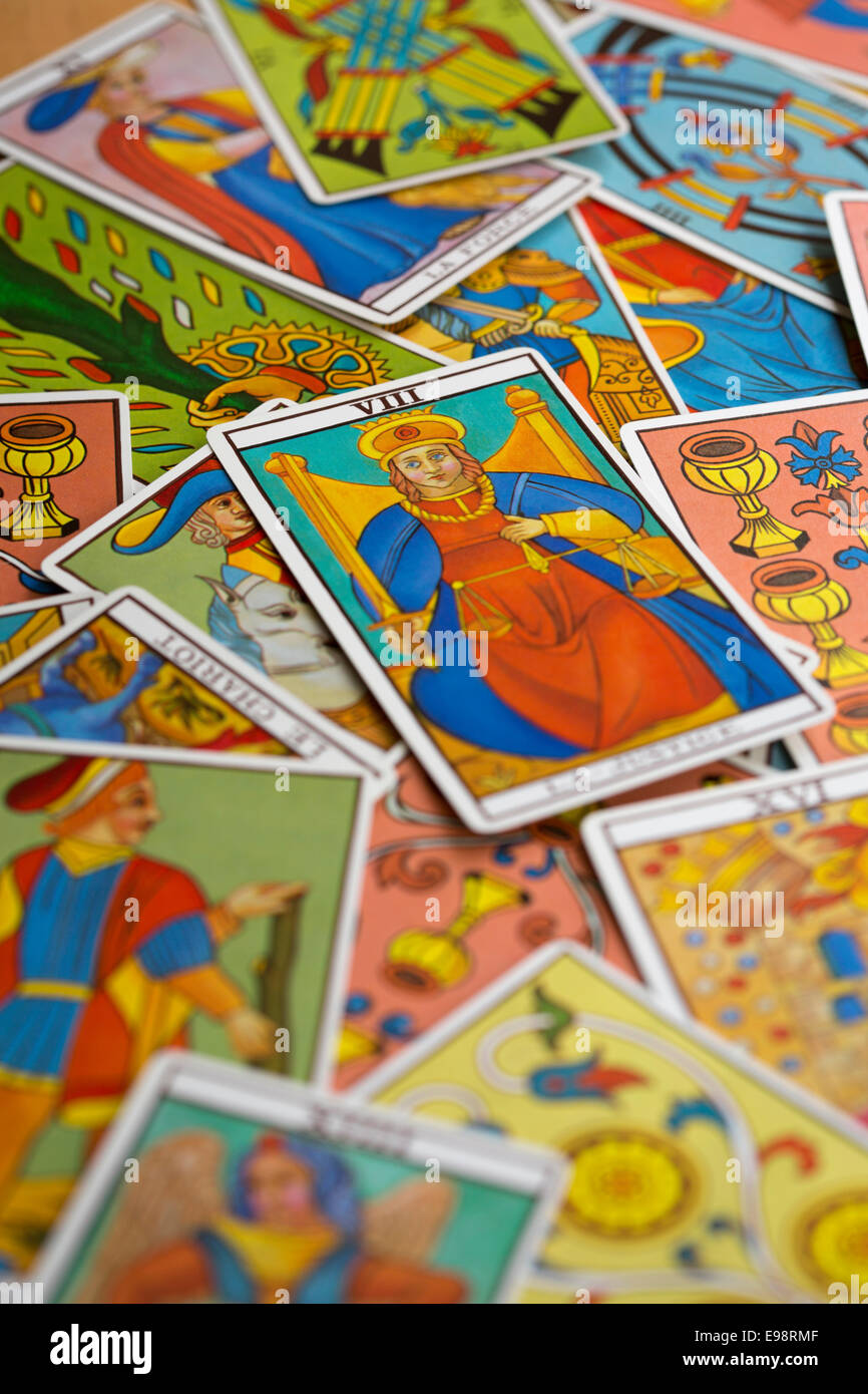 tarot cards spread out on table Stock Photo - Alamy