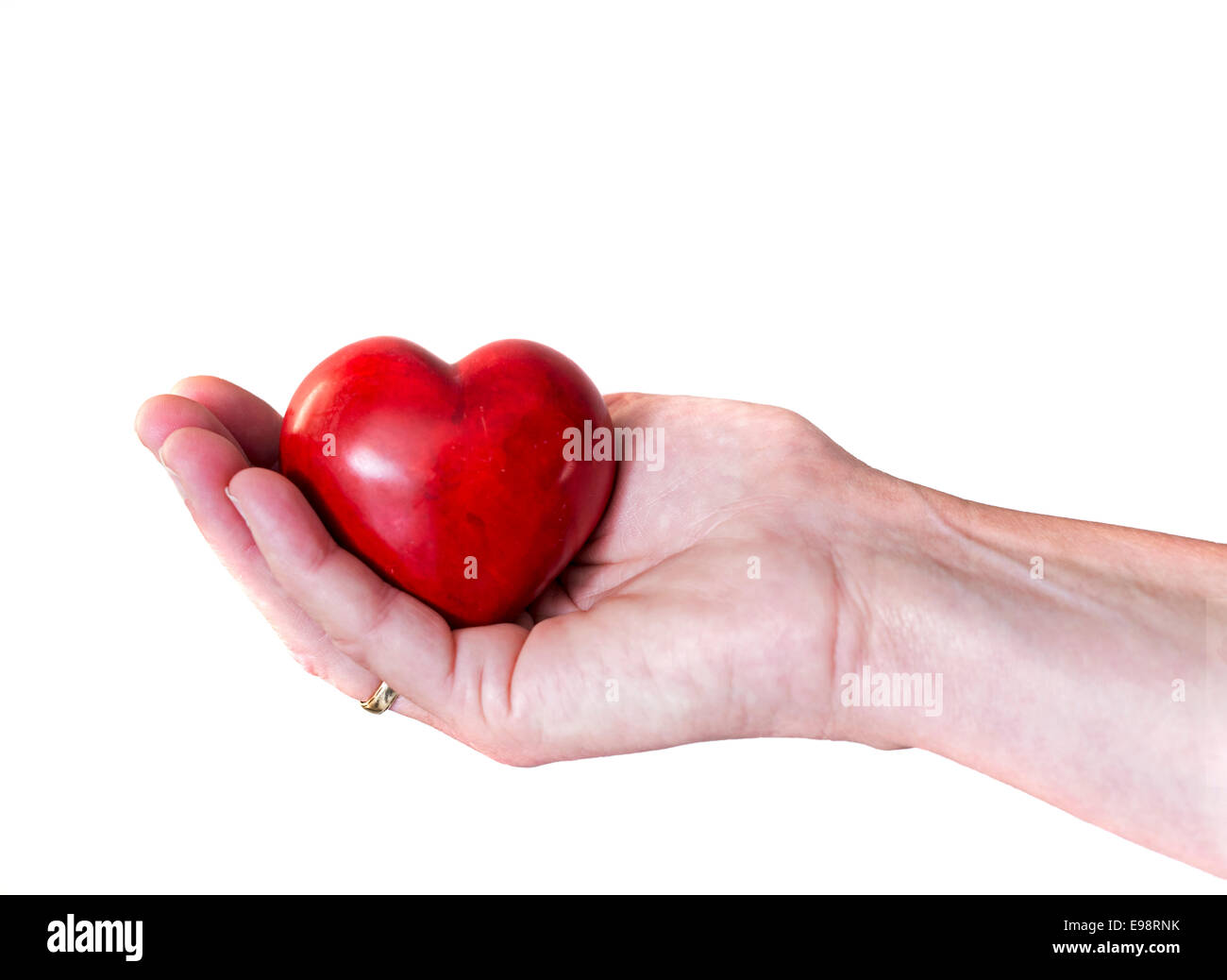 Hand gold heart Cut Out Stock Images & Pictures - Alamy