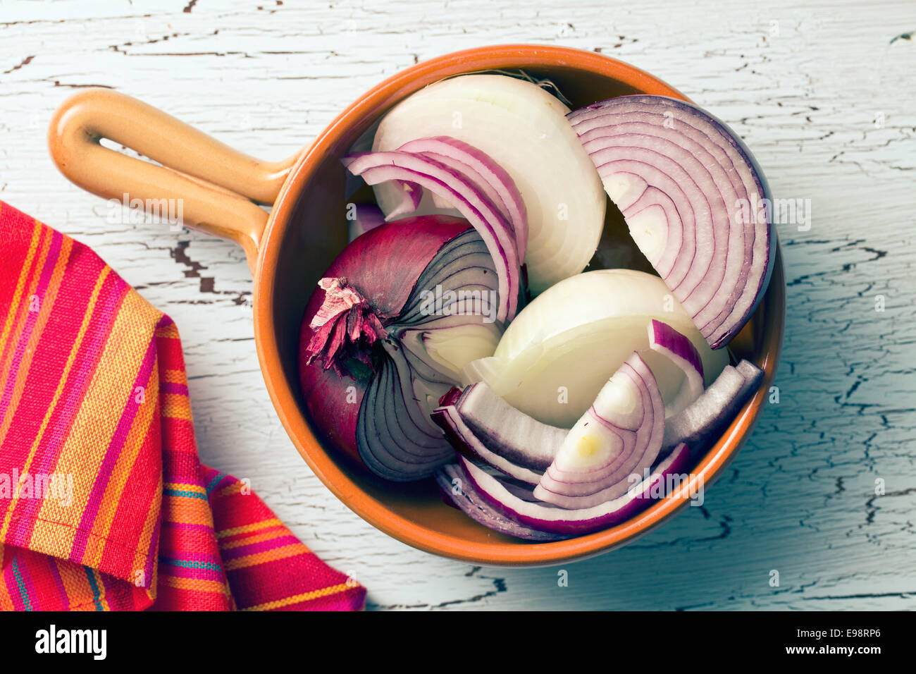chopped onion in ceramic pan Stock Photo - Alamy