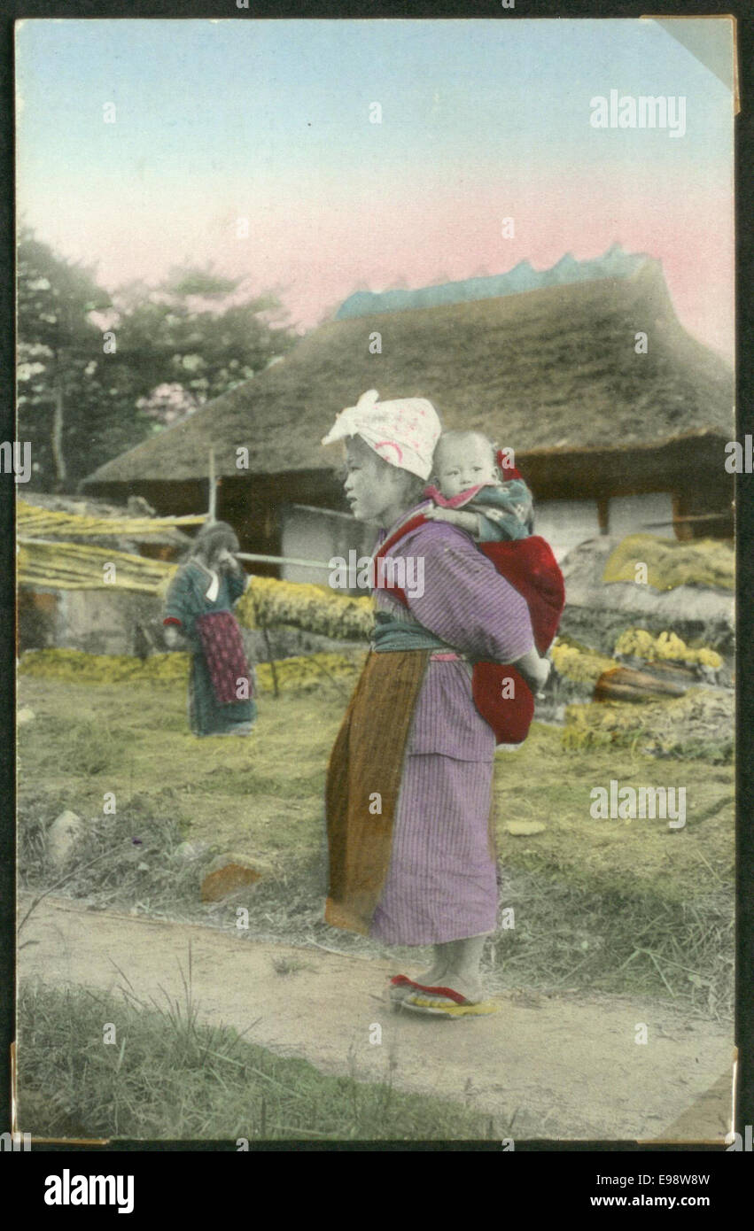 A photograph showing women with children in a rural Japanese village ...
