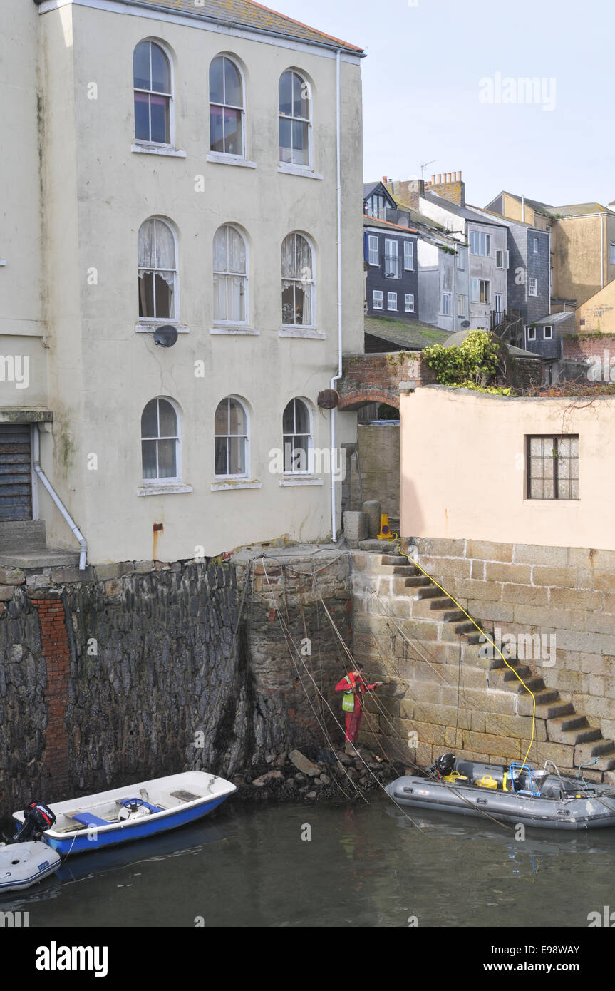 Harbour wall with boats and buildings Stock Photo - Alamy