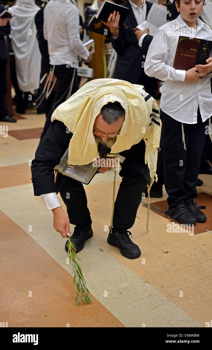 A religious Jewish man praying in a Brooklyn, New York synagogue on the ...