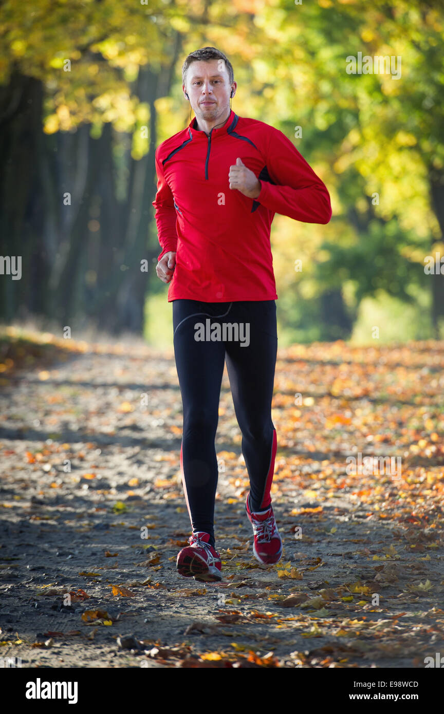 young man running in the park Stock Photo - Alamy