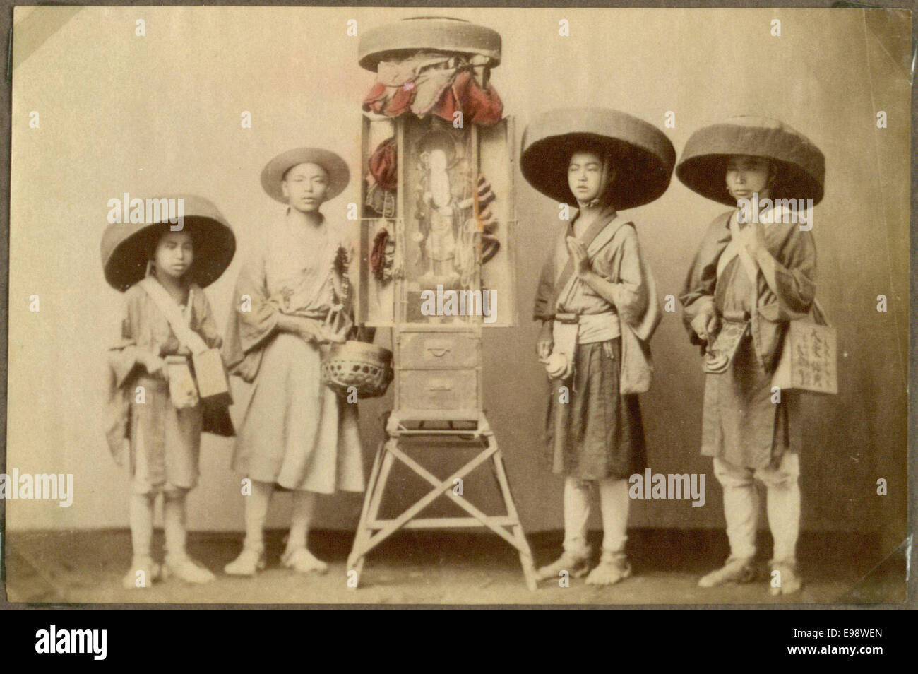 A hand-colored photograph of Japanese pilgrims, dressed in traditional ...