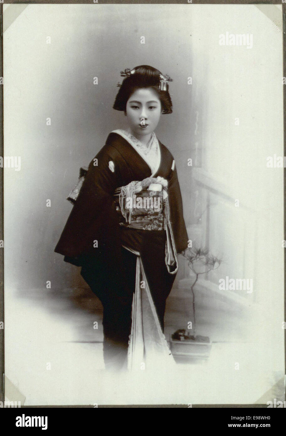 Photograph of a Geisha in traditional Japanese attire, showcasing her ...