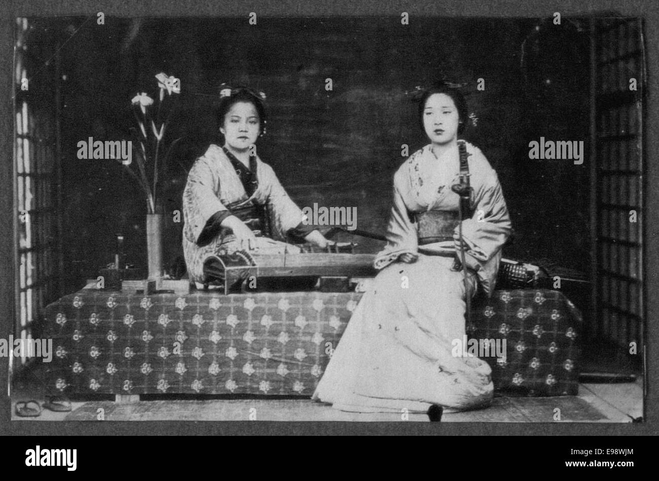 A photograph of two female singers in Japan, captured in a performance ...