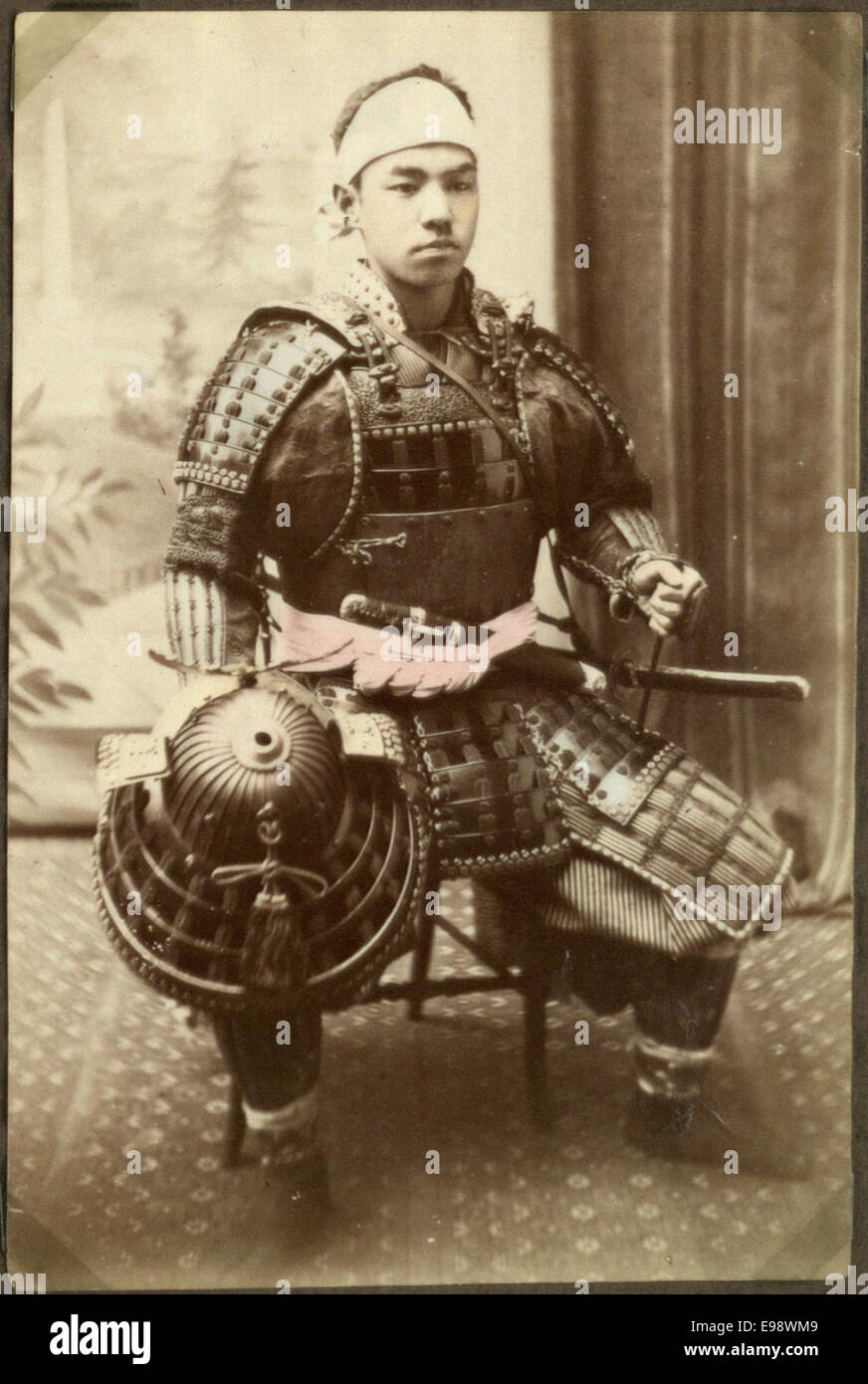This image depicts a Japanese warrior dressed in traditional armor. The ...
