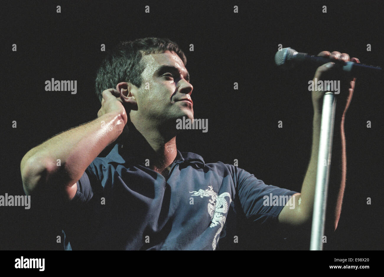 Robbie Williams in concert in Edinburgh, Scotland, in 1999 Stock Photo ...
