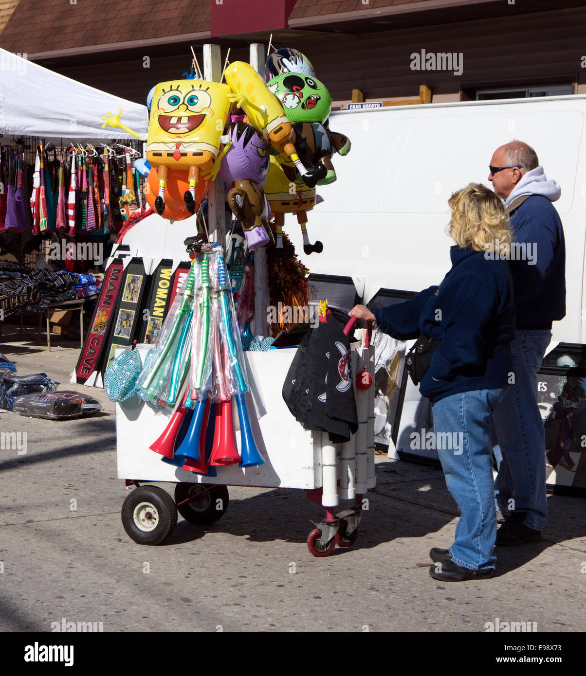 Vendor with cart at street fair Stock Photo - Alamy