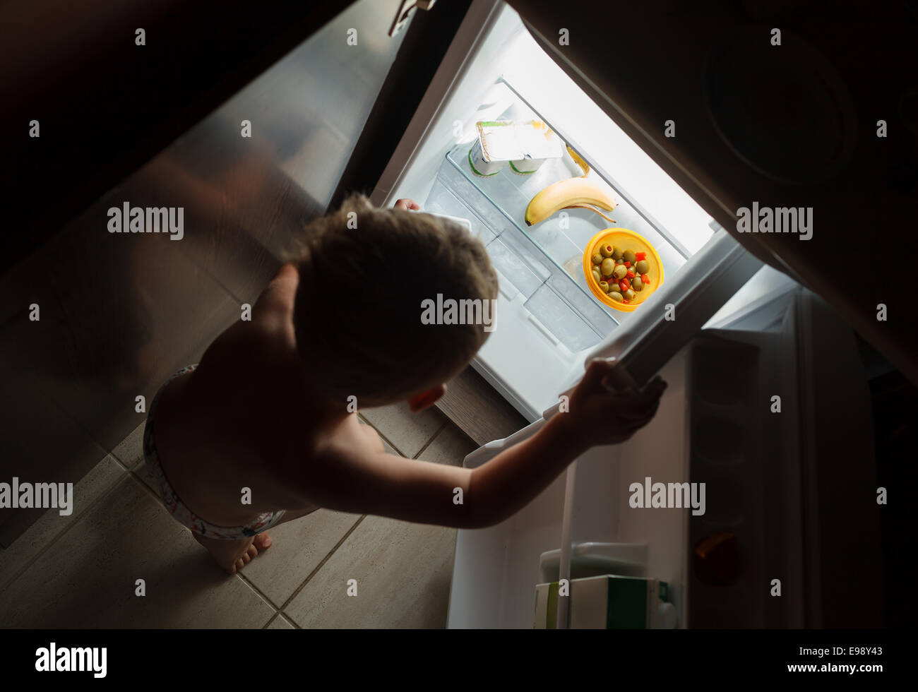 Little hungry boy at night Stock Photo - Alamy