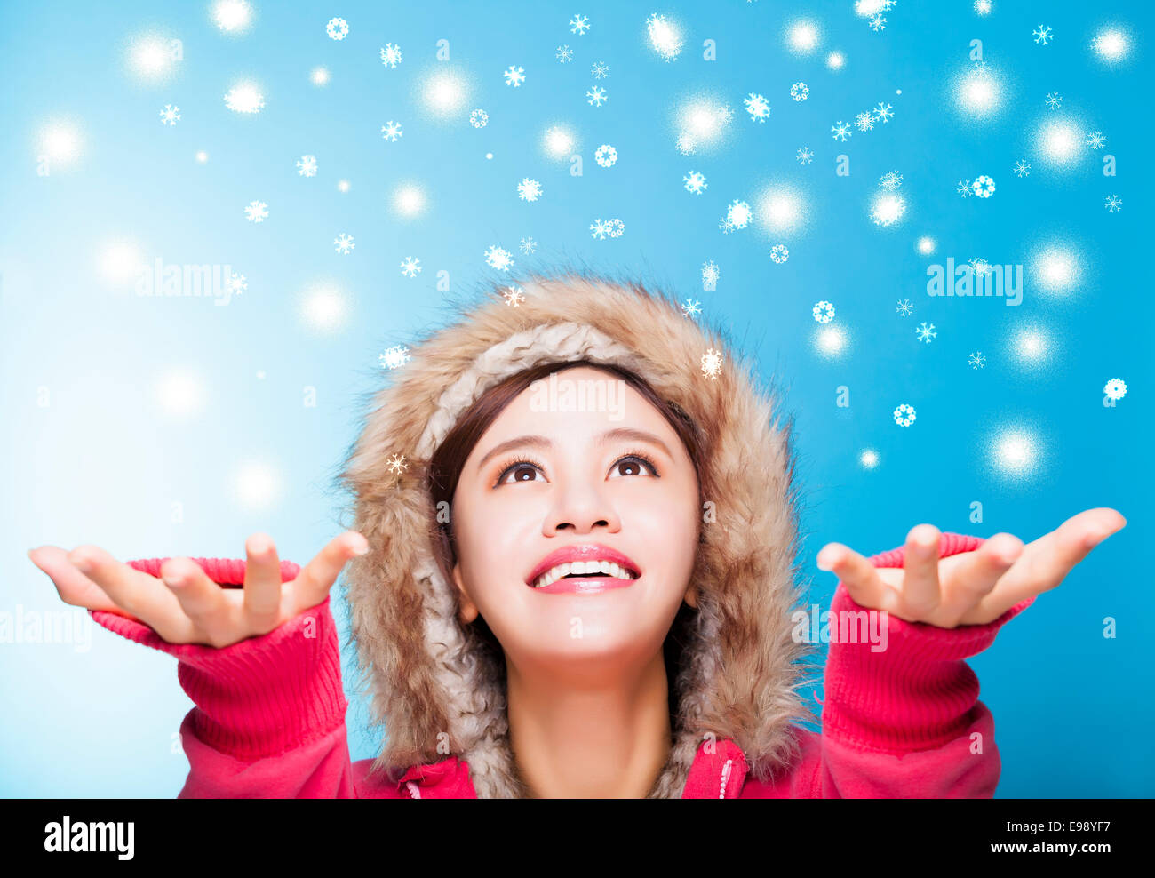 happy young woman watching snow Stock Photo - Alamy
