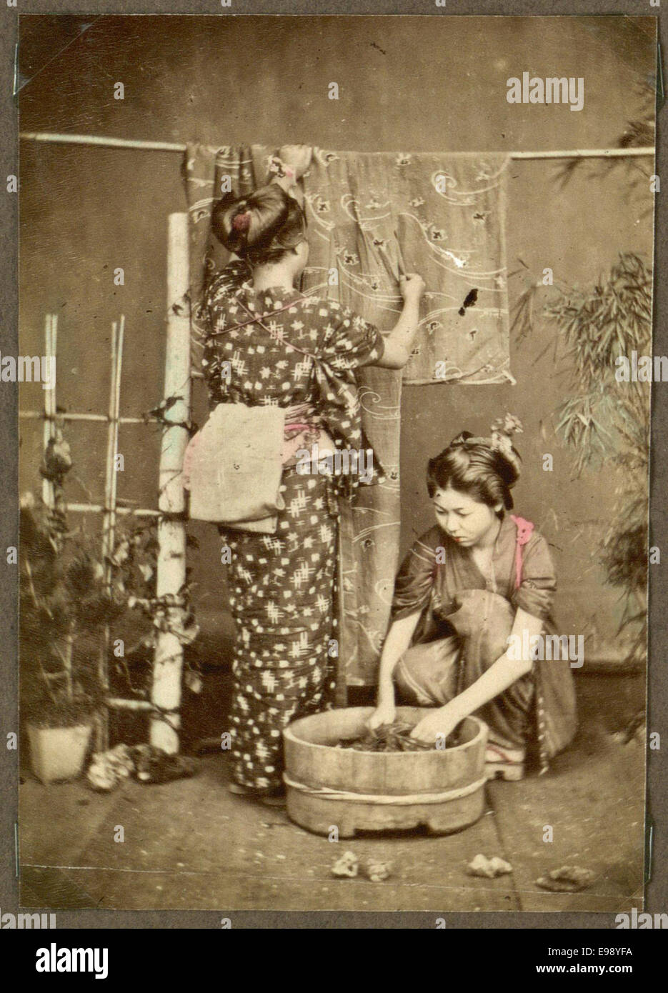 A historic photograph showing Japanese women washing clothes in a ...